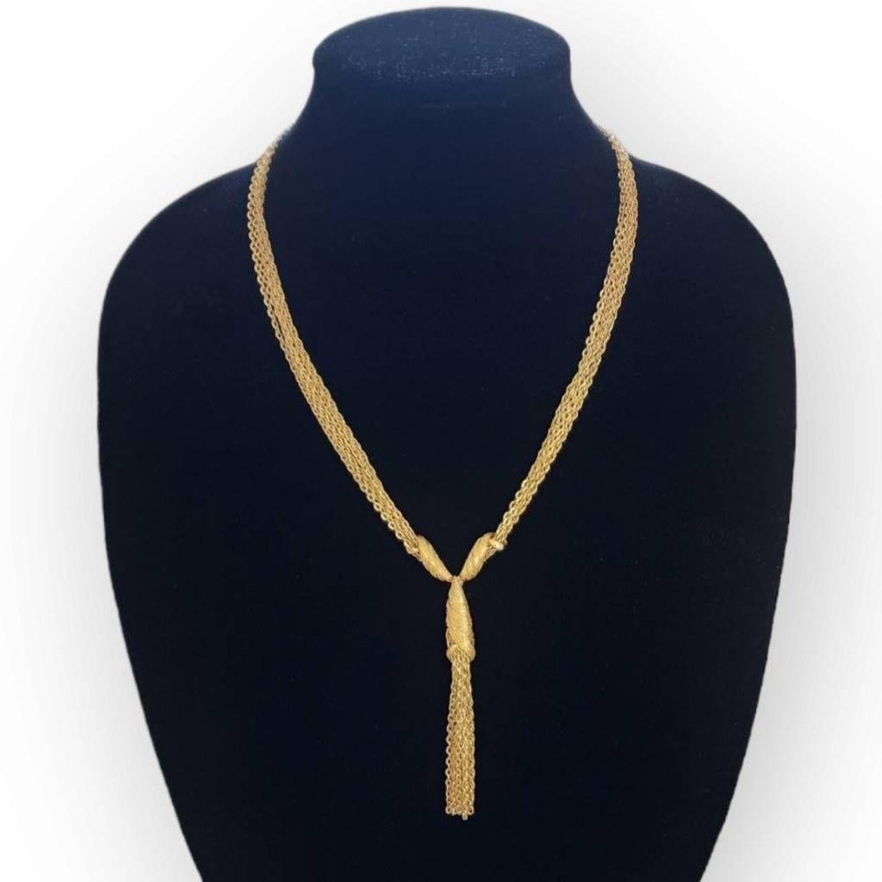 Elegant swirls wrap around the multi-strand chains... - Depop