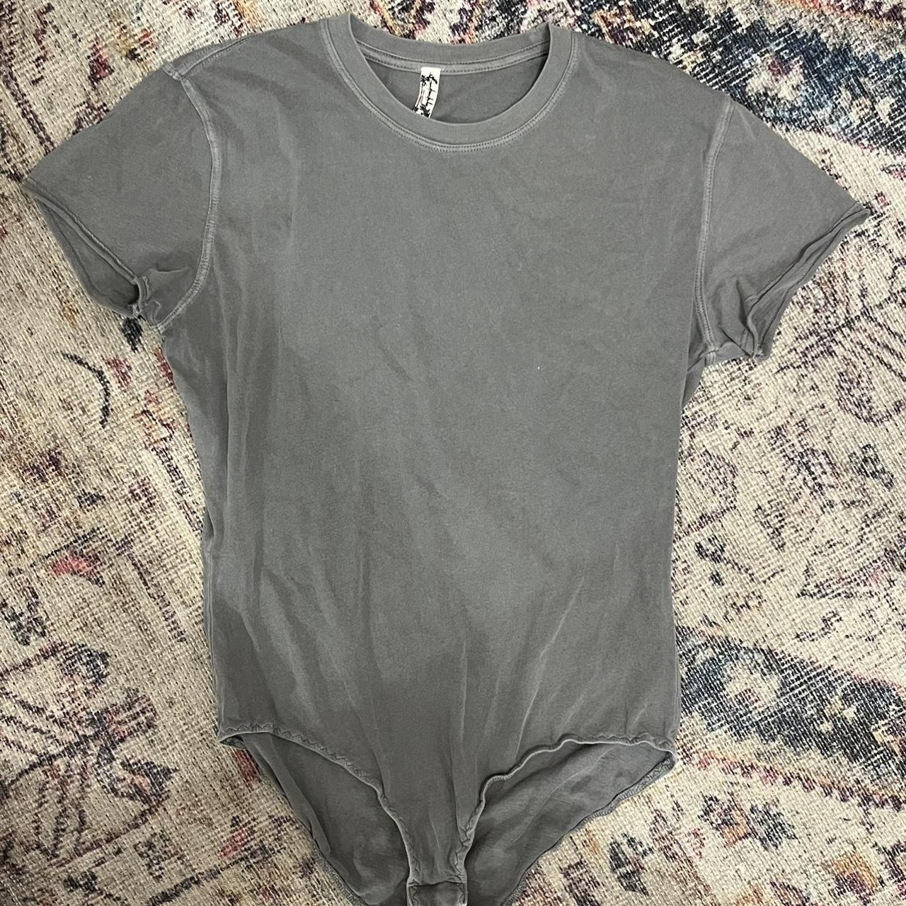 Free people gray T-shirt bodysuit never won before... - Depop