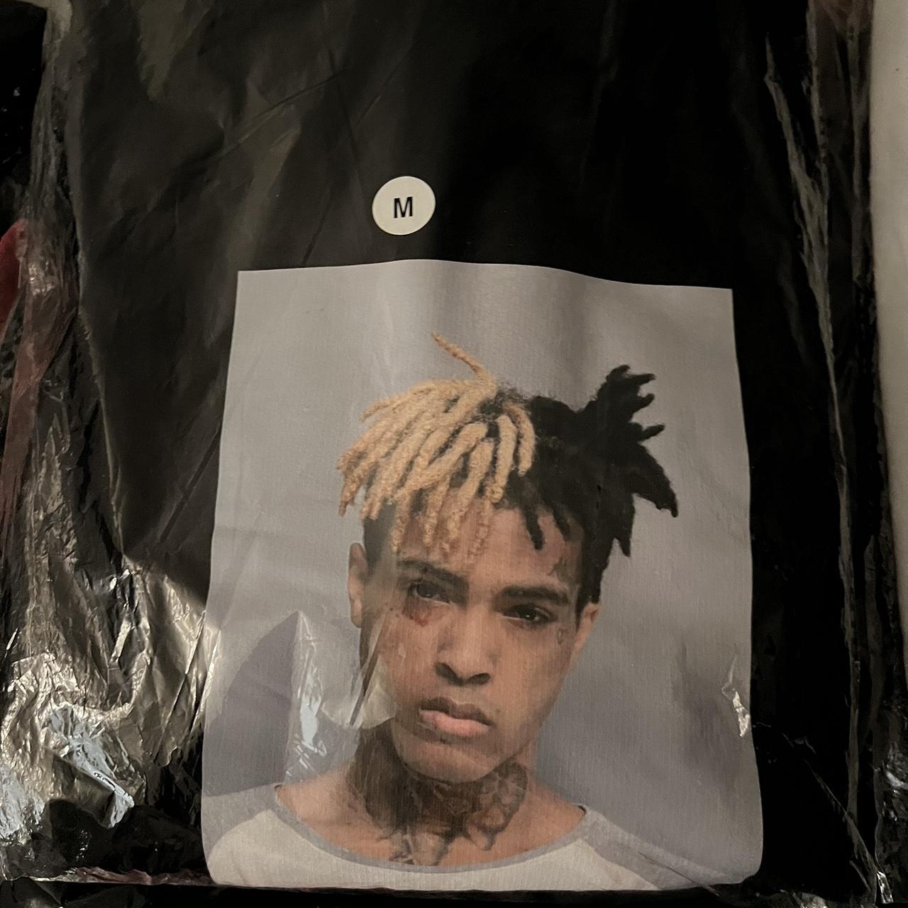(Ds) Revenge XXXTENTACION MUGSHOT HOODIE BLACK TEXT... | Depop