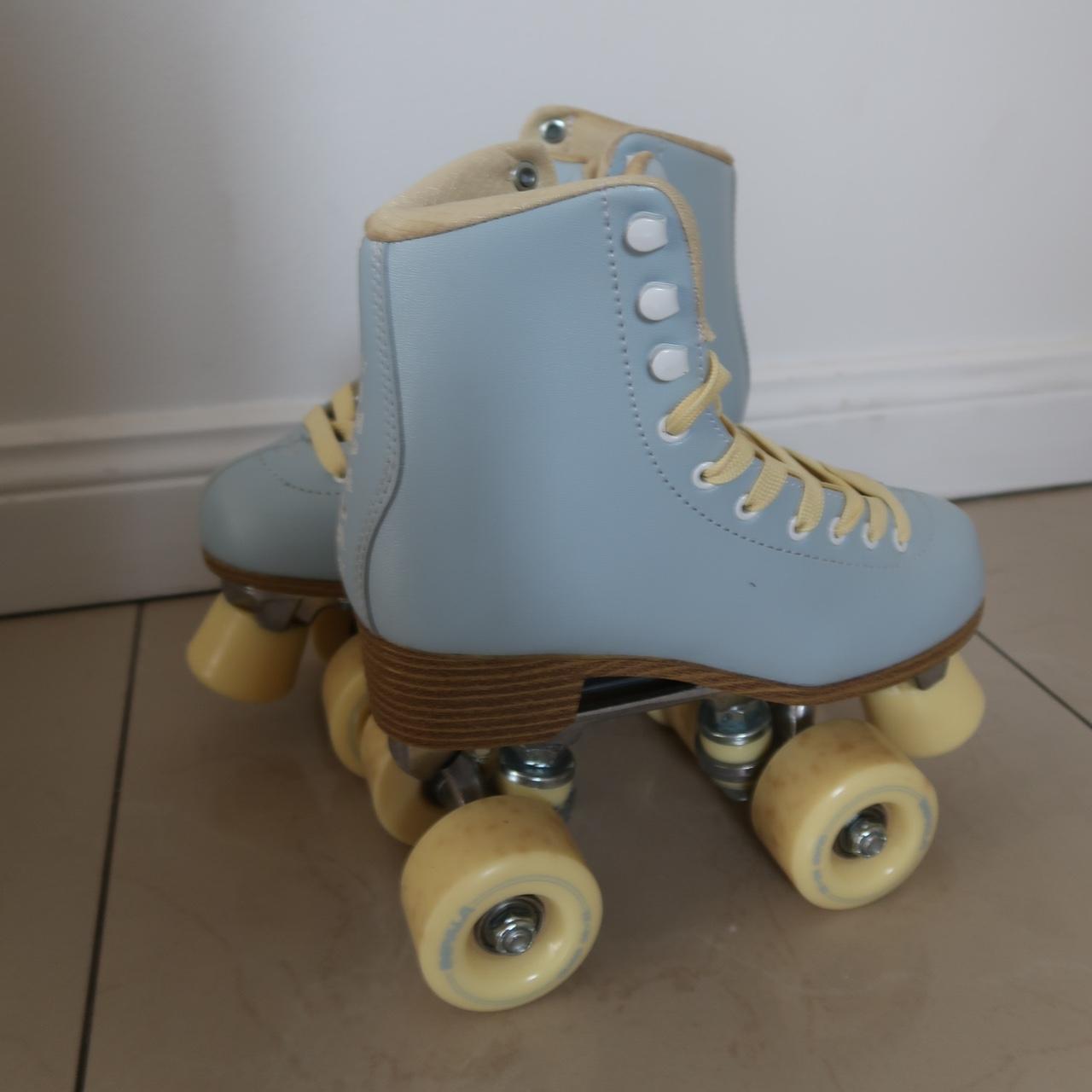 Baby blue Impala quad roller skates with yellow... - Depop