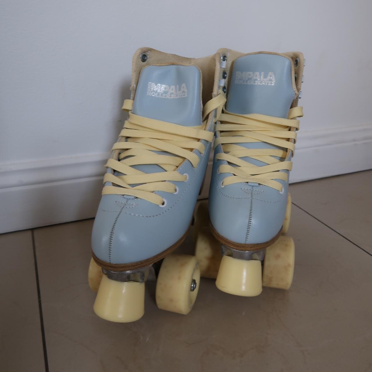 Baby blue Impala quad roller skates with yellow... - Depop