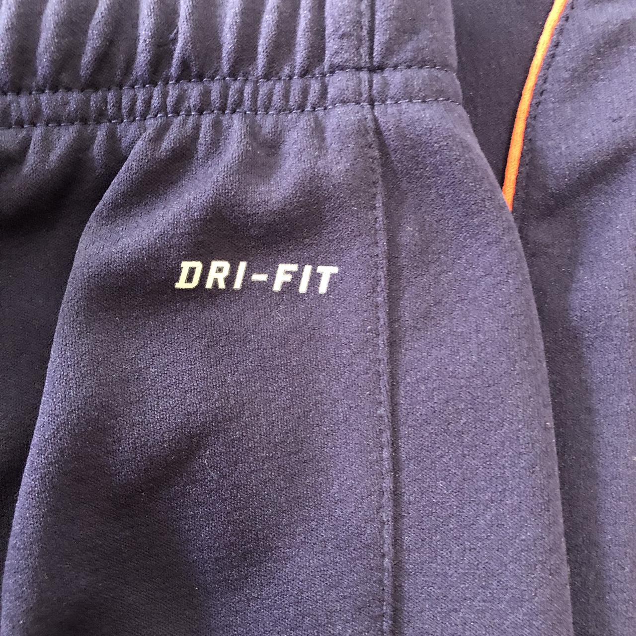 Dark purple Nike dry-fit athletic pants with neon... - Depop