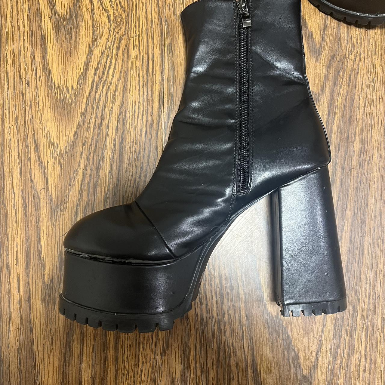 Very high platform shoes. Is coming off on the left... - Depop