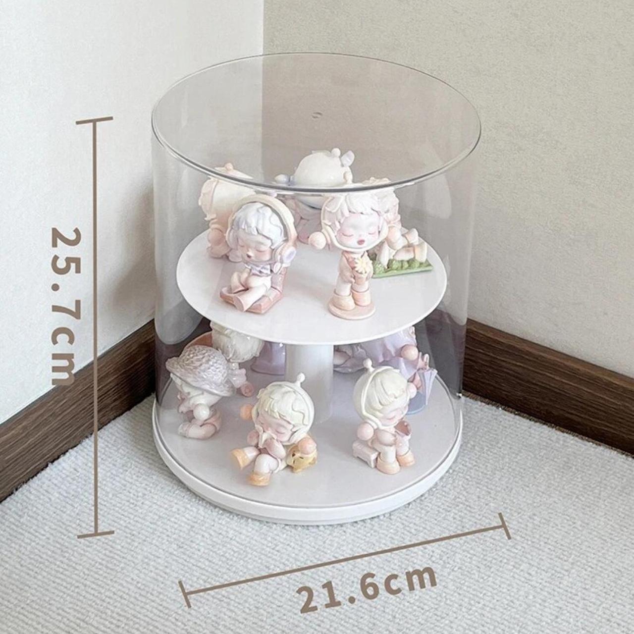 Spinning display stand for collectibles with plastic... - Depop