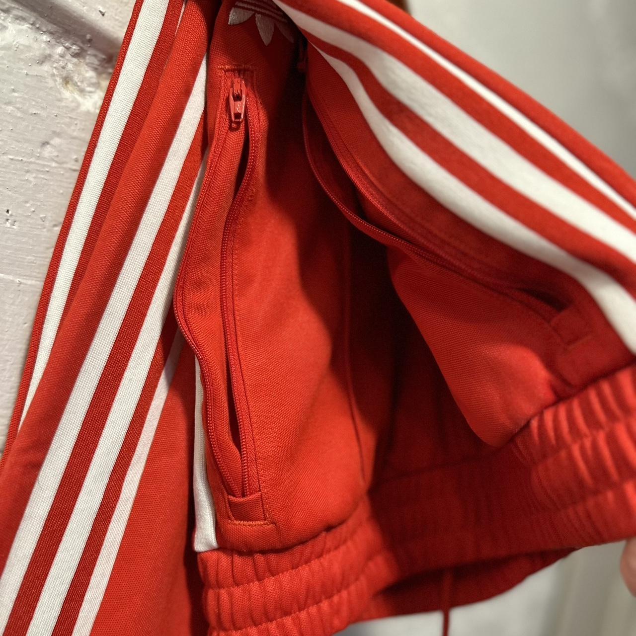 Adidas casual classic red pants. Stripes on each leg... - Depop