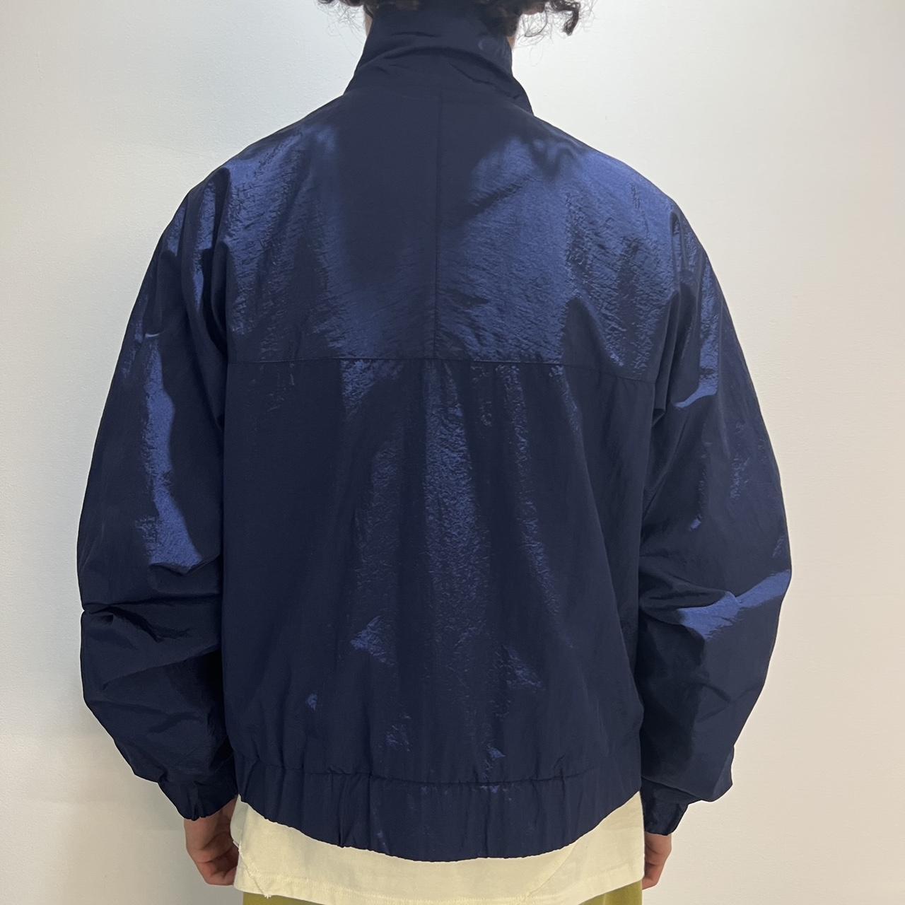 Navy blue embroidered-logo windbreaker from... - Depop