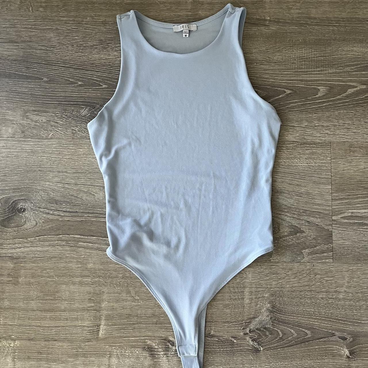 medium light blue bodysuit, worn a couple times. - Depop