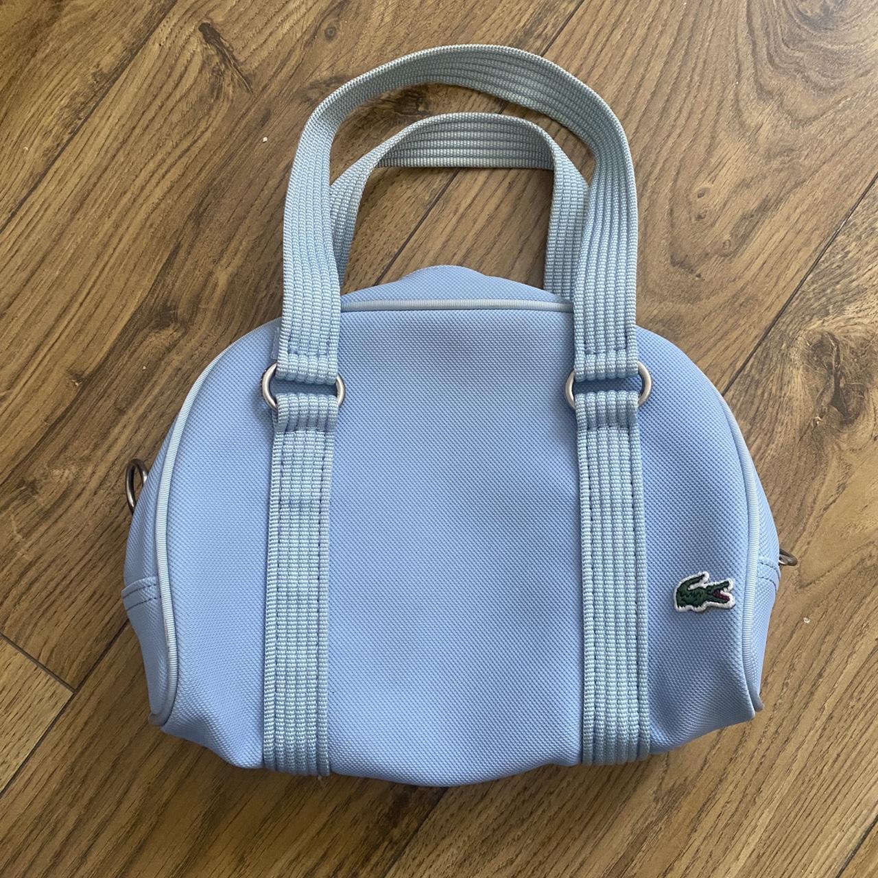 Lacoste light blue hand bag with striped interiors. - Depop