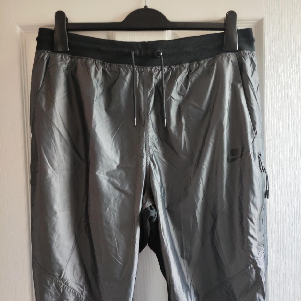 Grey Nike joggers Shell type material with mesh... - Depop