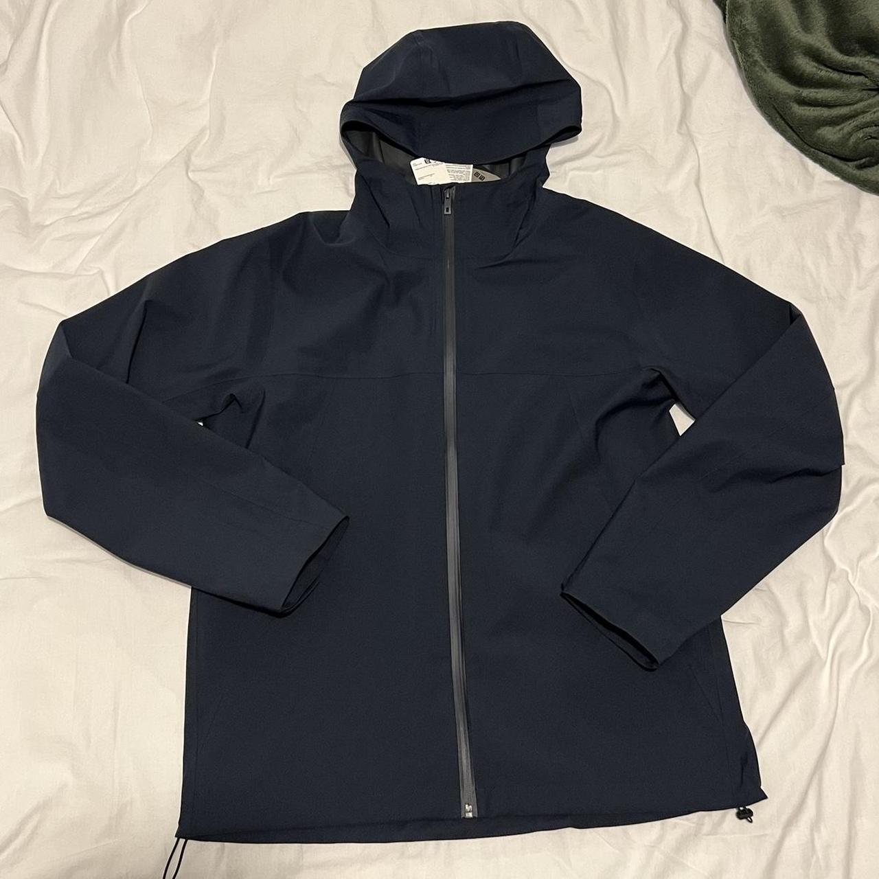Uniqlo waterproof jacket navy size M brand new lost... - Depop
