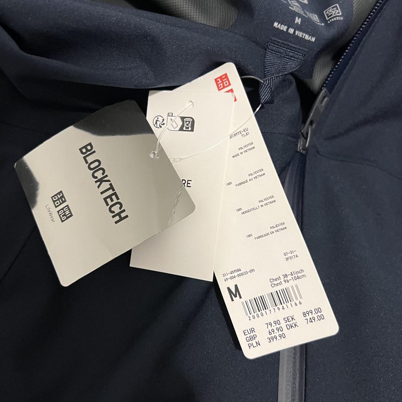 Uniqlo waterproof jacket navy size M brand new lost... - Depop