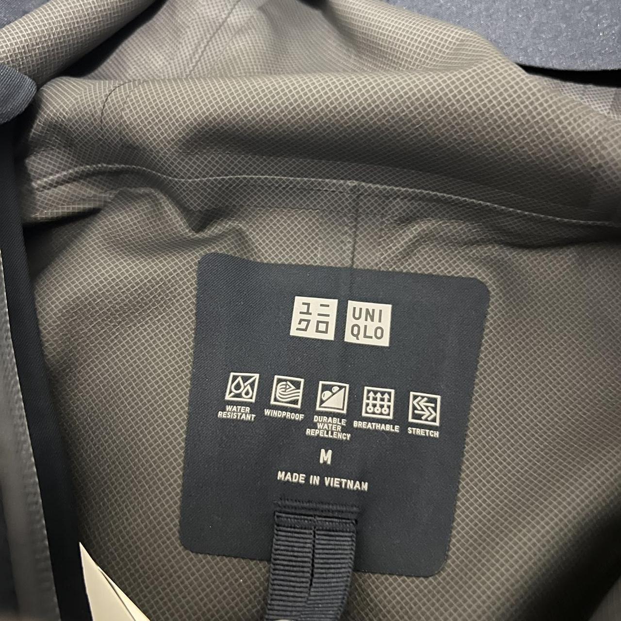 Uniqlo waterproof jacket navy size M brand new lost... - Depop