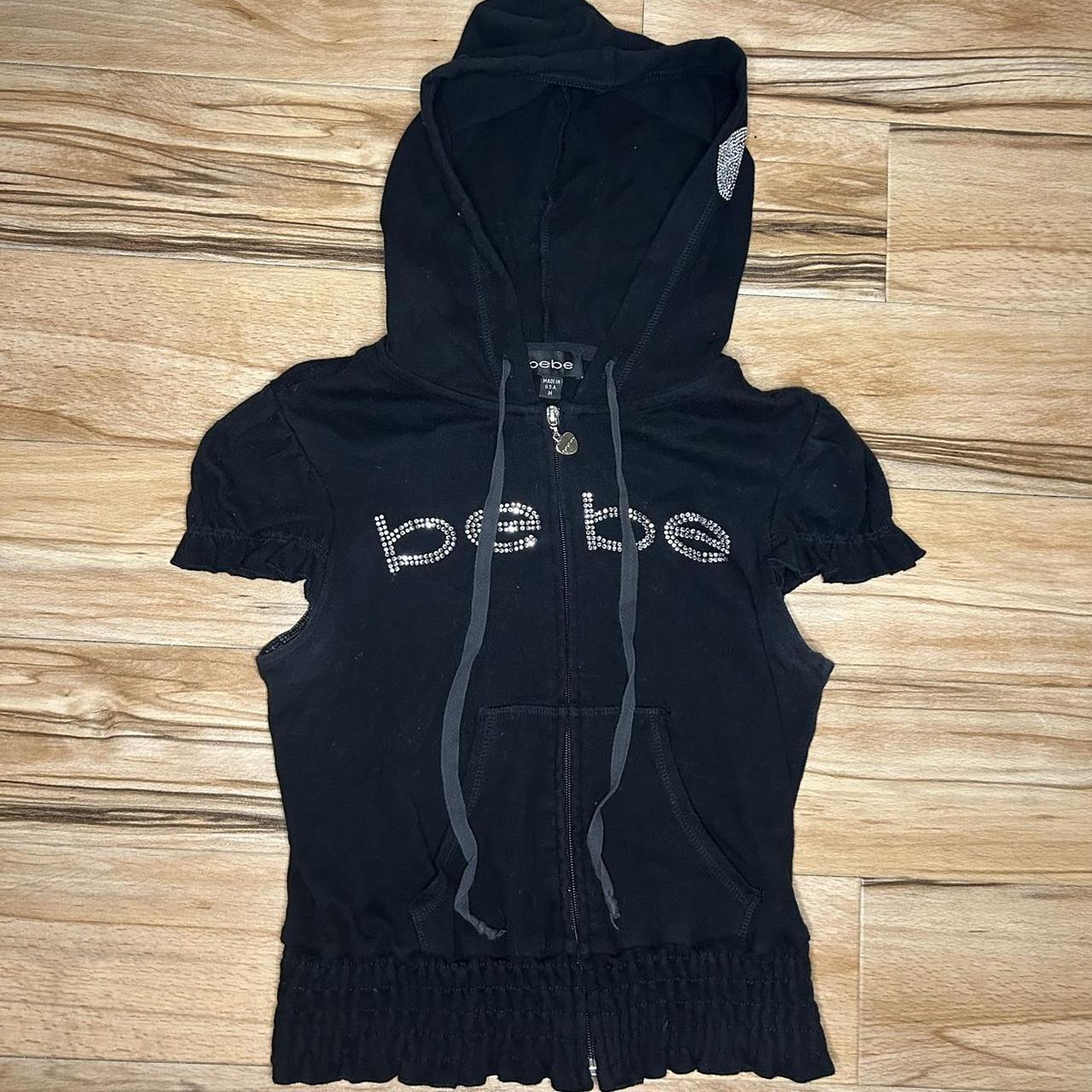 Black Bebe ruffle top with bedazzled logo... - Depop