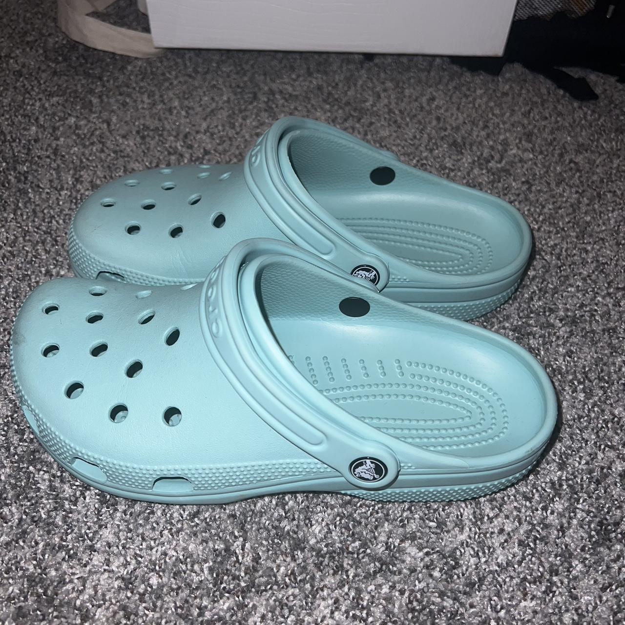 light blue crocs. some markings but i will clean... - Depop