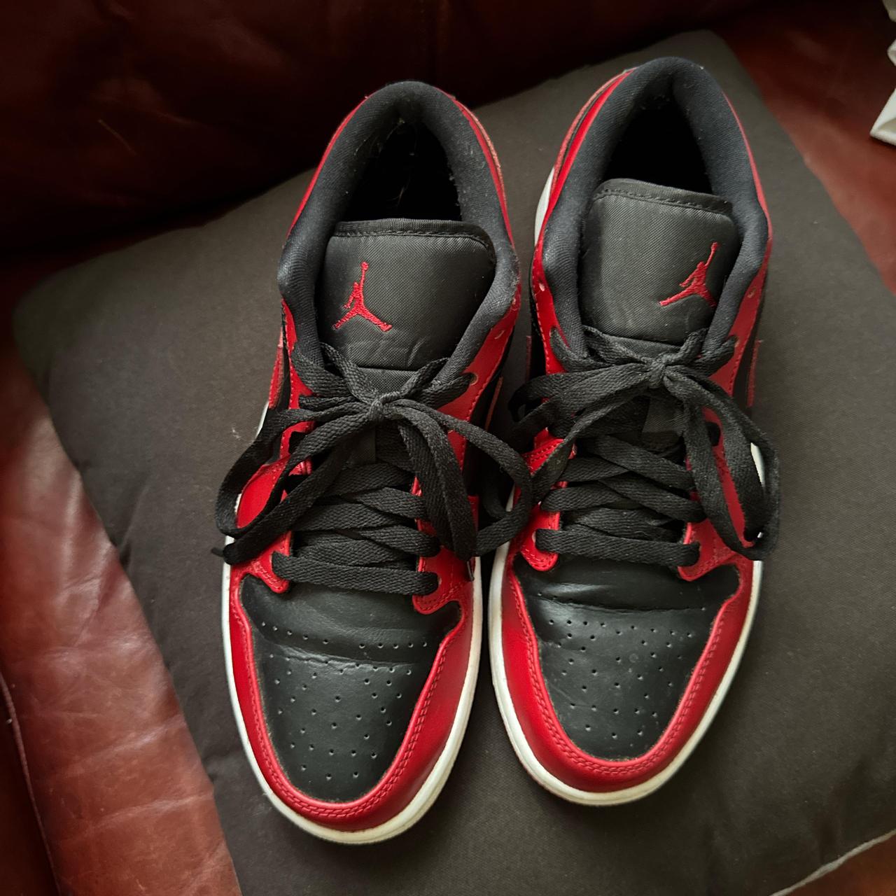 Low top red and black Air Jordans. Worn handful of... | Depop