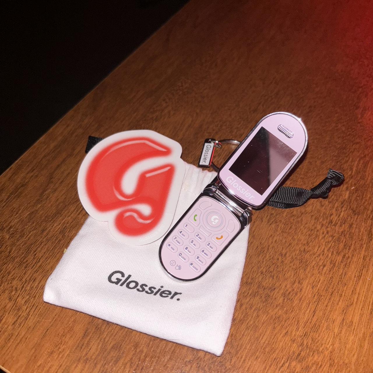 Glossier flip phone Keychain. LA exclusive , will... - Depop