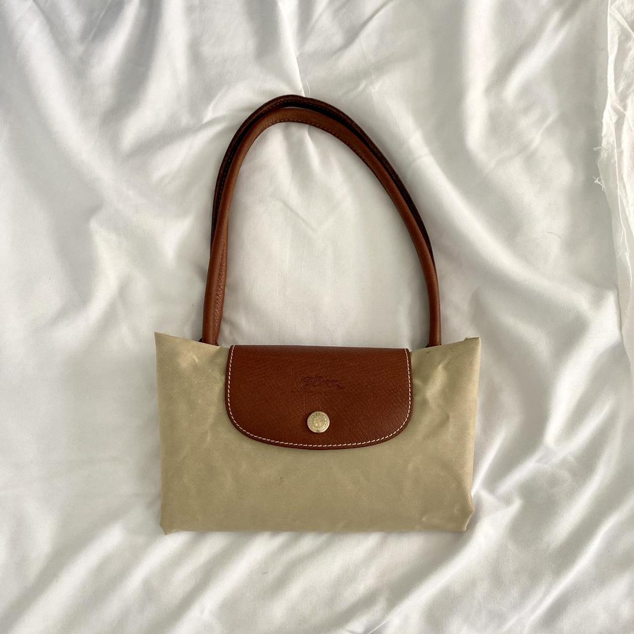 Small Longchamp Le Pliage tan bag!! Definitely some... - Depop