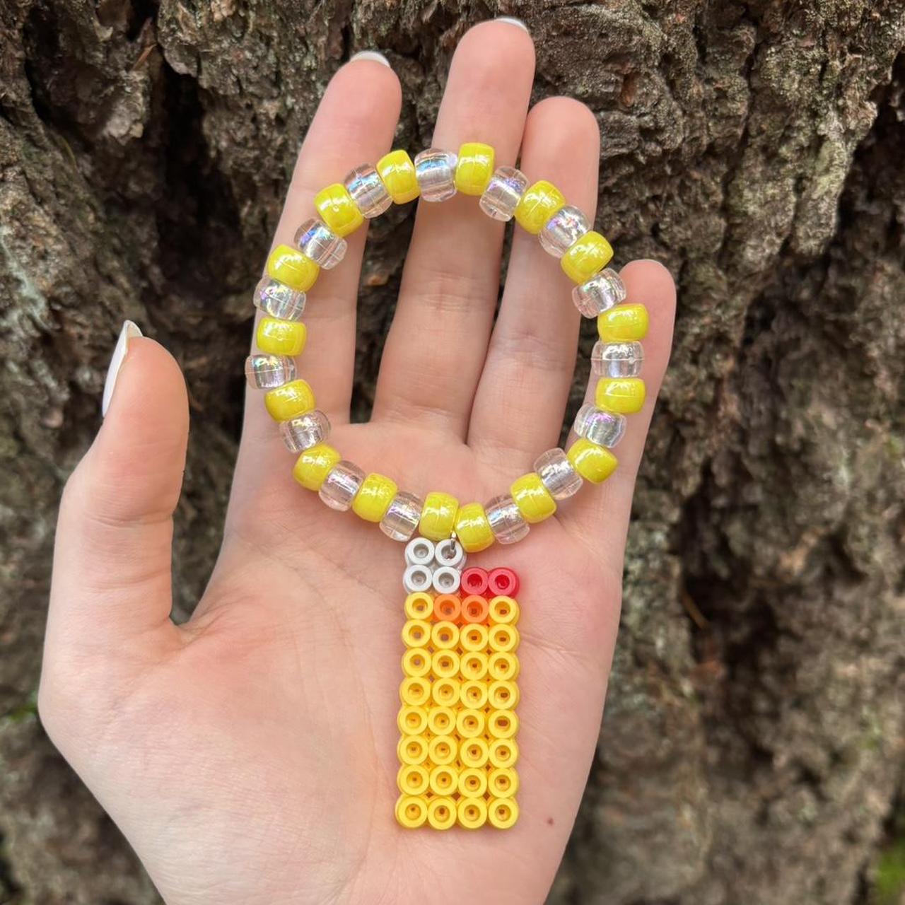 Yellow kandi single with perler lighter charm one... | Depop