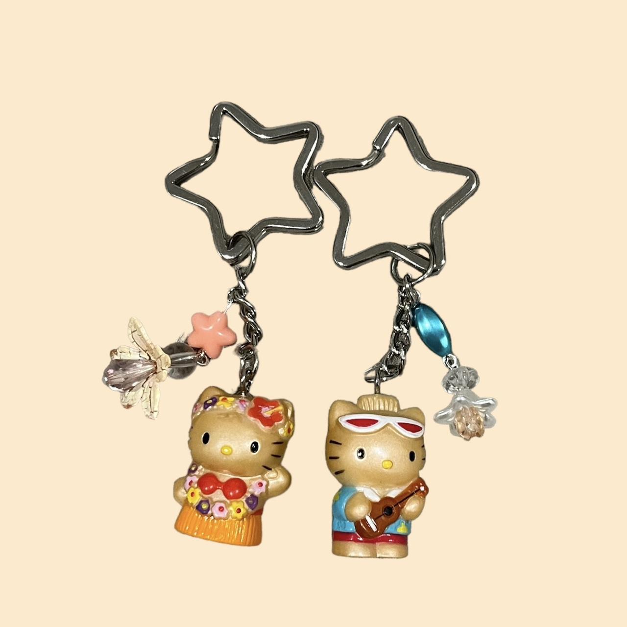 Couple Hawaii hello kitty and Daniel keychain... - Depop