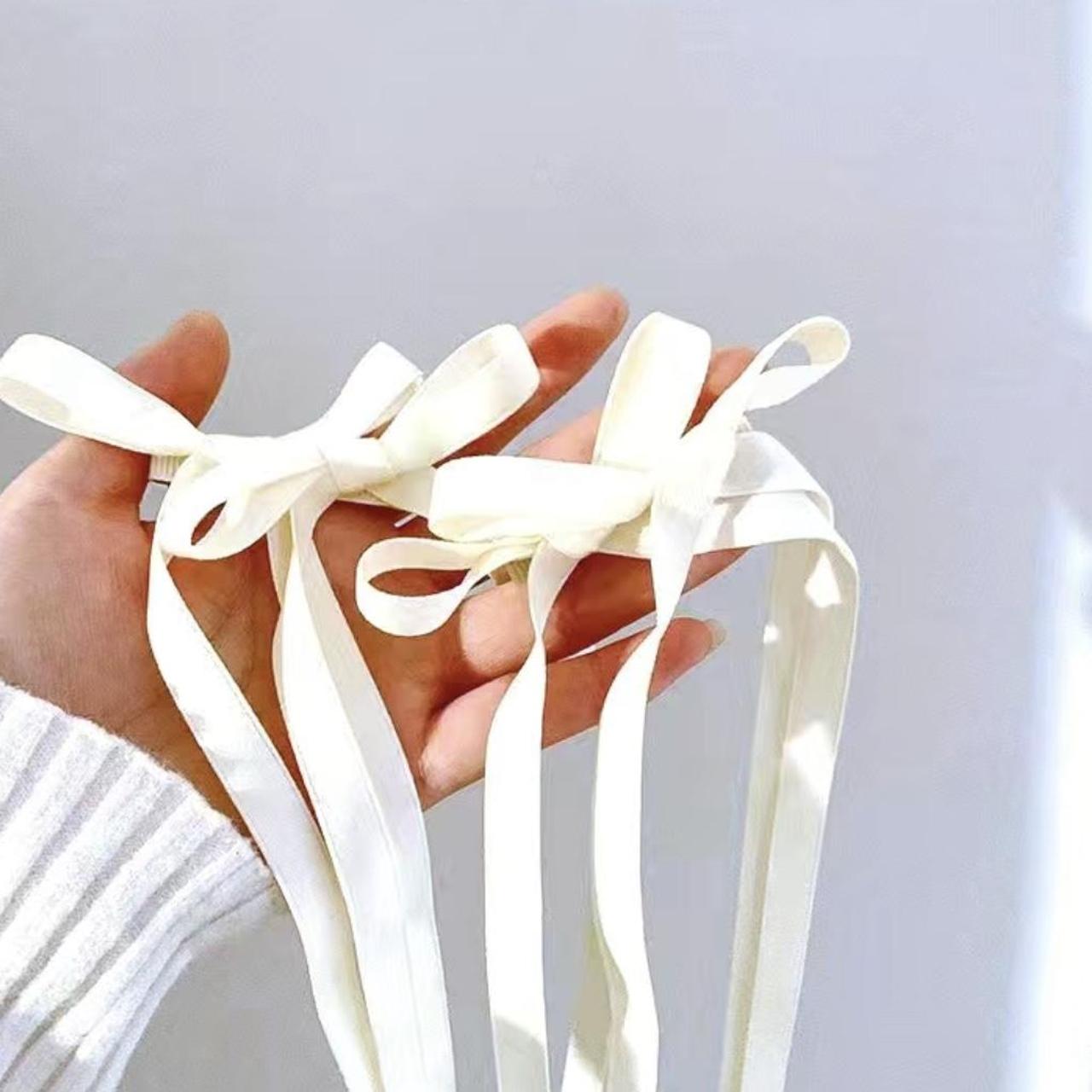 Cute white bow hair clips with long tassels... - Depop