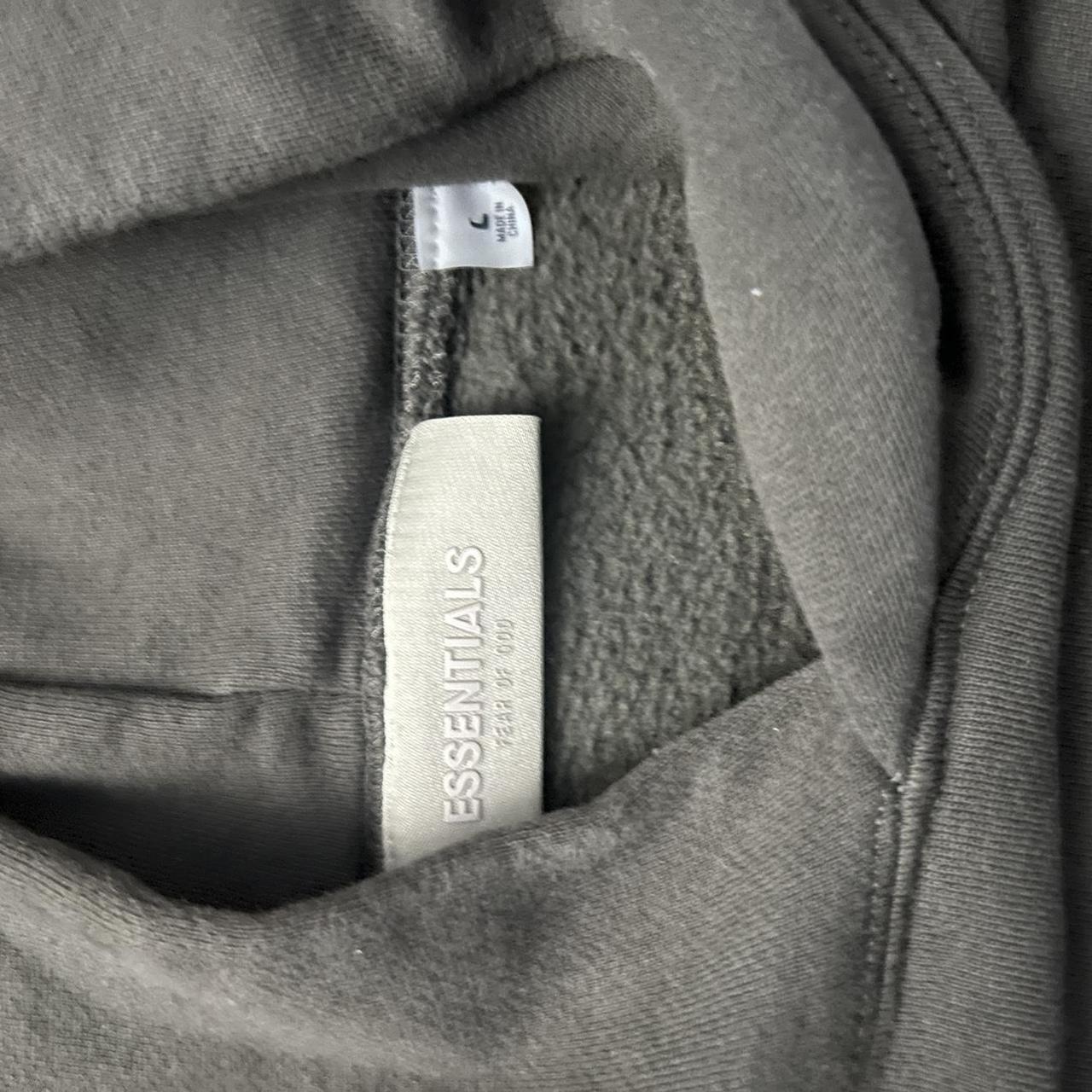 Essentials OffBlack hoodie, tagged large but shrank... - Depop