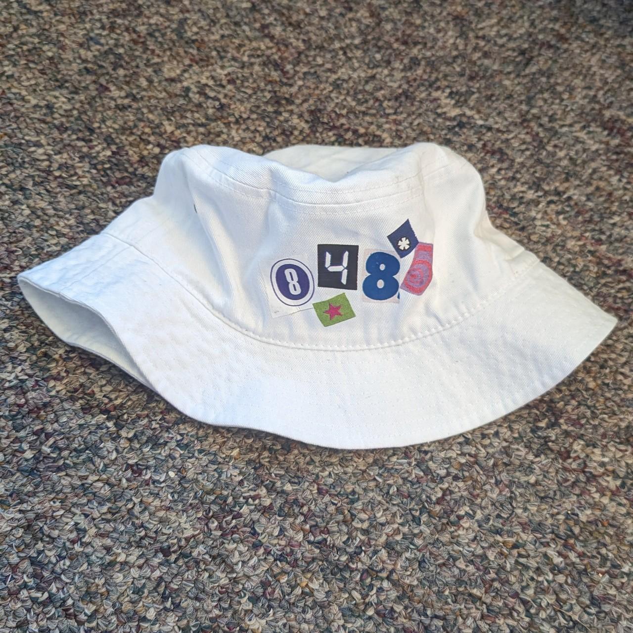 White 8485 bucket hat from a limited merch drop not... - Depop