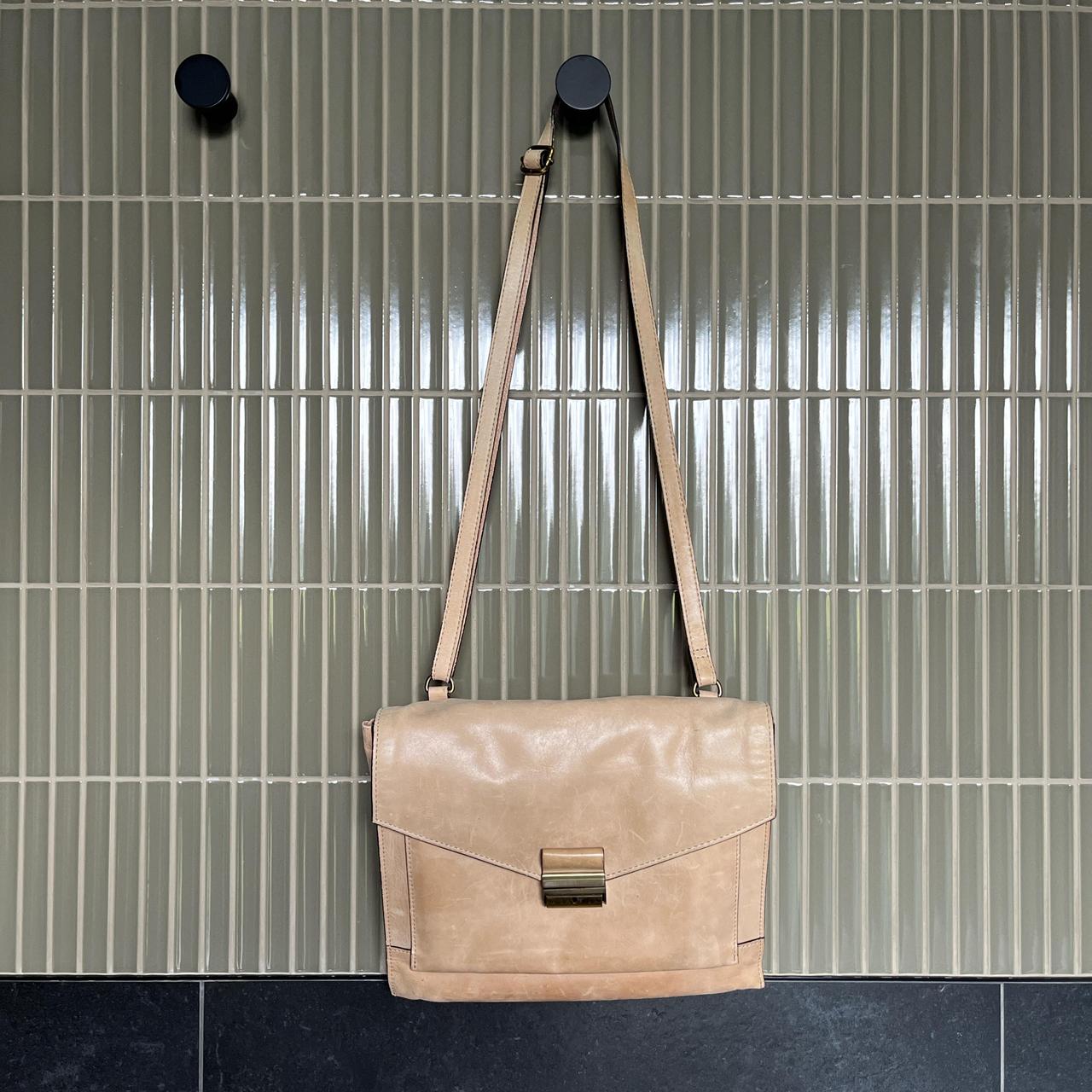 Tan and cream leather bag with a long strap that can... - Depop