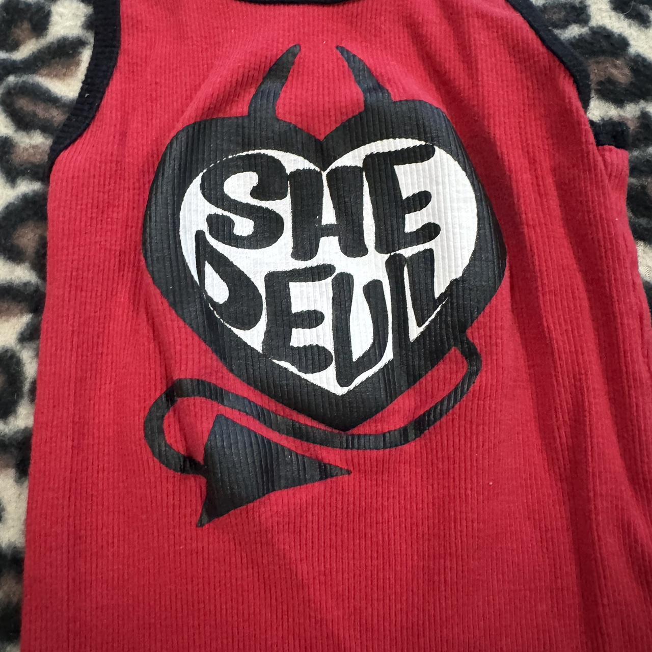 Red and black She Devil tank top tagged a M but can... - Depop