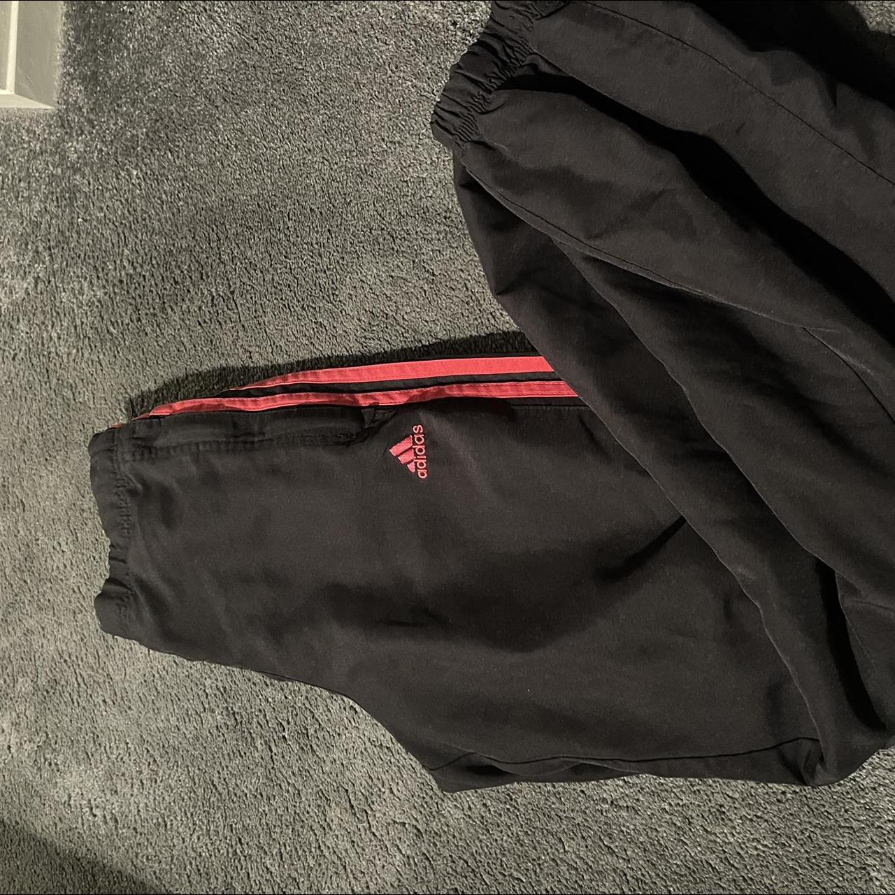 black adidas trackpants with pink stripes barely... - Depop