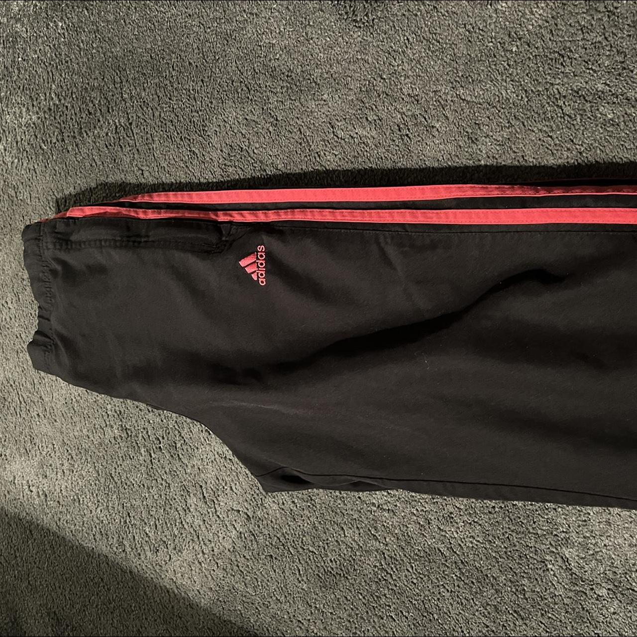black adidas trackpants with pink stripes barely... - Depop