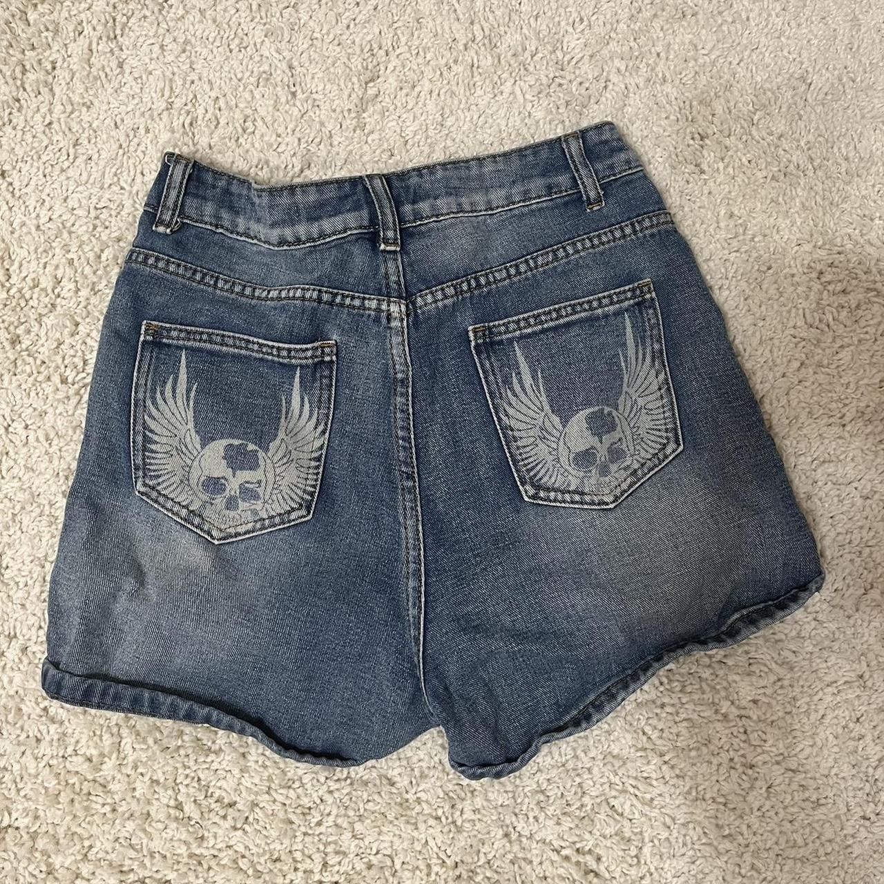 blue denim shorts, skull with wings on back pockets.... - Depop