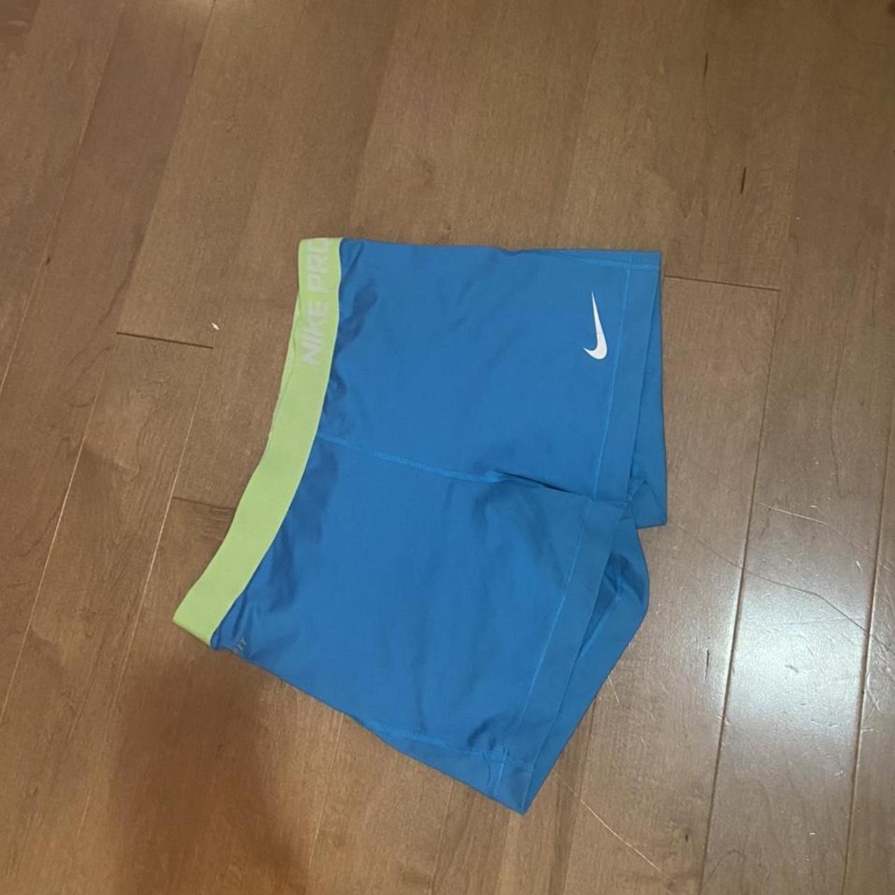 Green & blue Nike shorts. Labelled as size L, but... - Depop