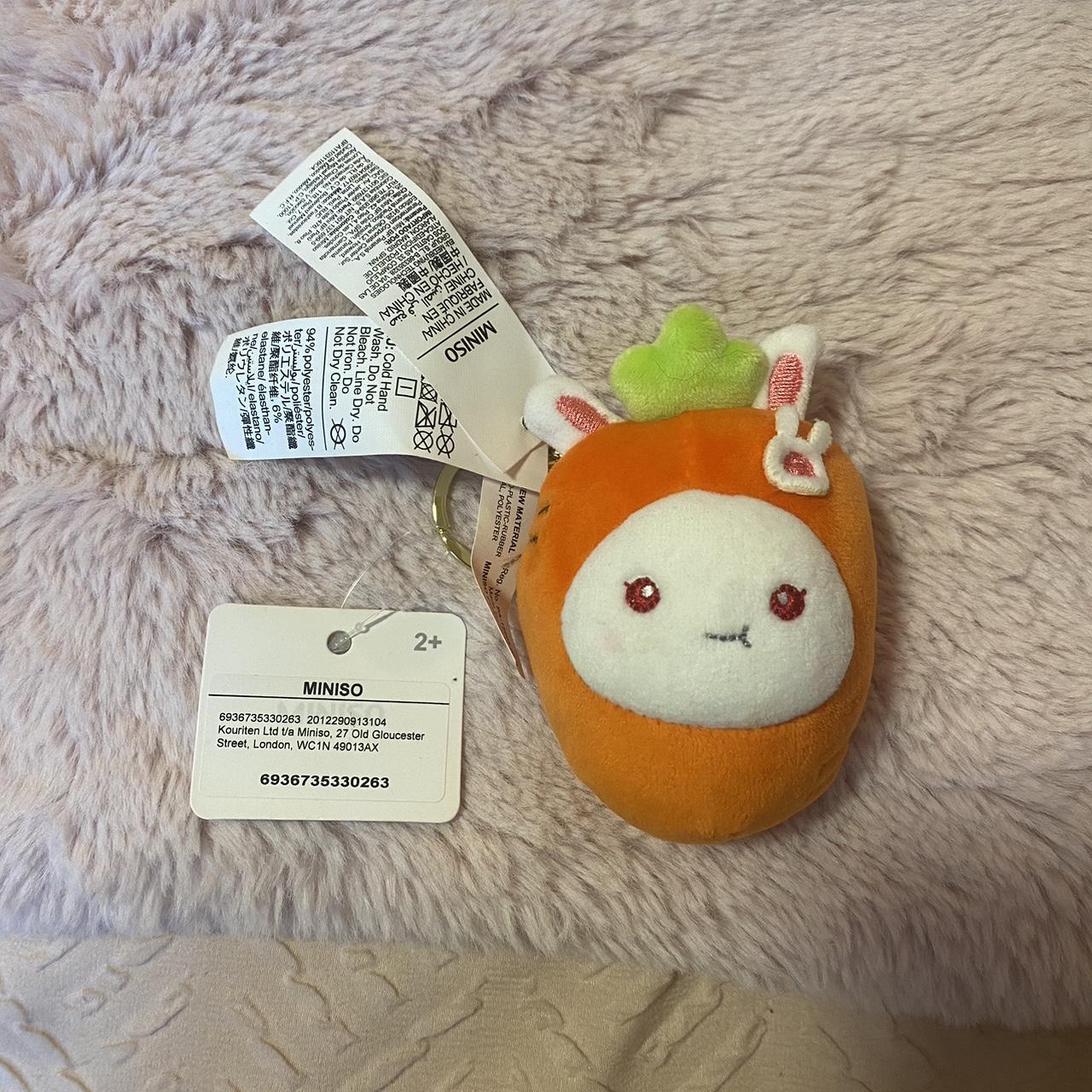 Cute Miniso carrot squishy keychain fidget toy... - Depop