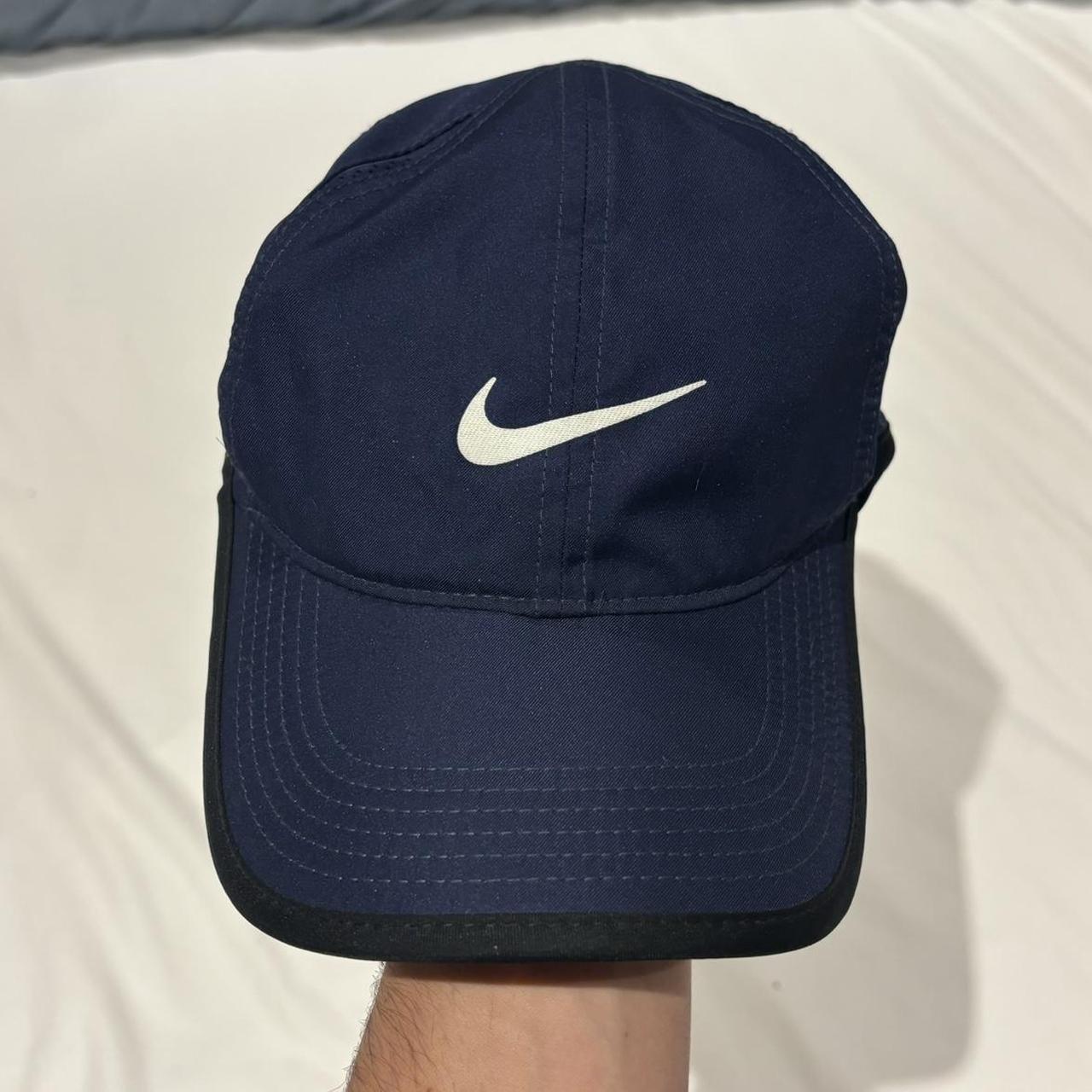 navy blue dri-fit nike hat with white nike logo and... - Depop