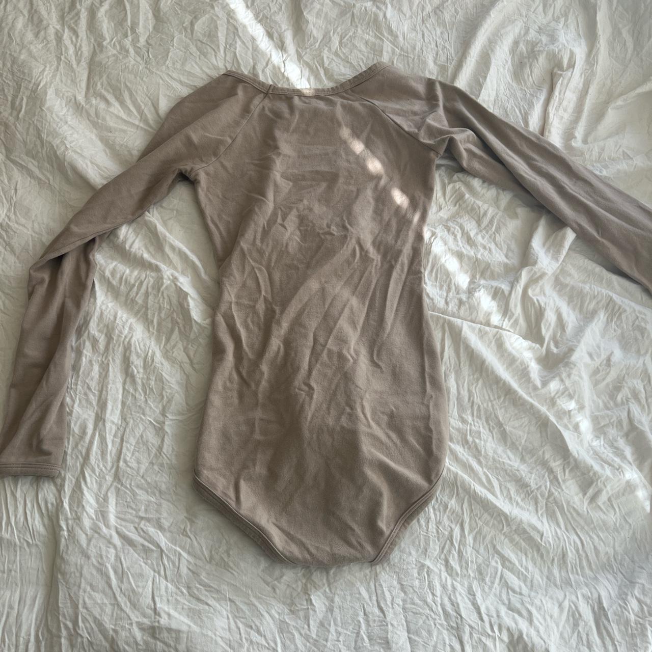 ARQ taupe bodysuit in a size small - Depop
