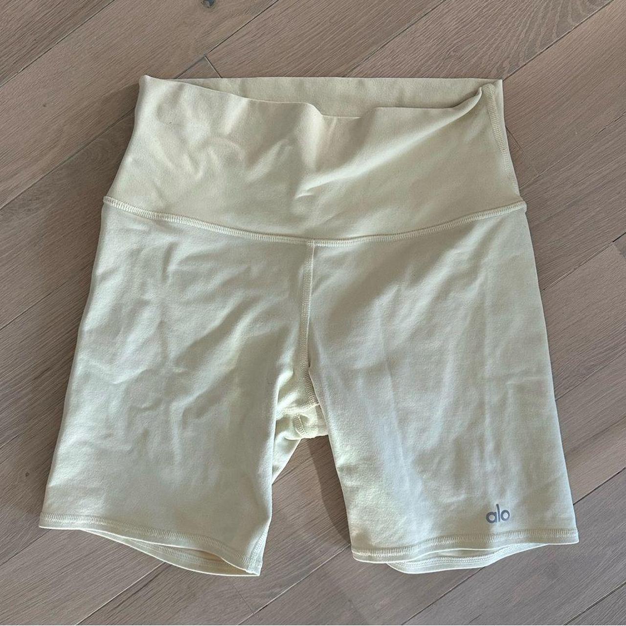 Alo yoga pastel yellow shorts in size small Gently... - Depop