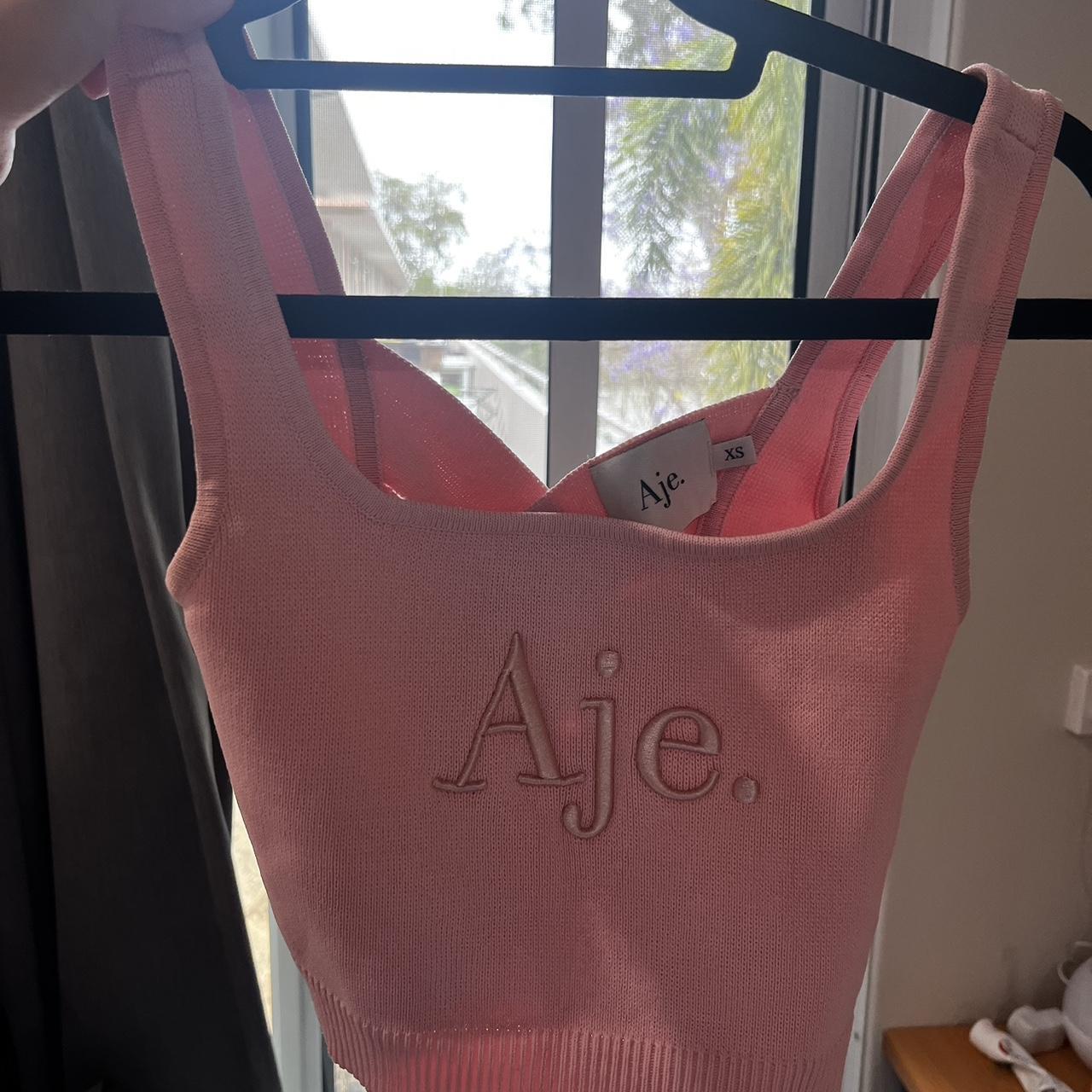 AJE Pink Crop Top with plait detail at the back-... - Depop