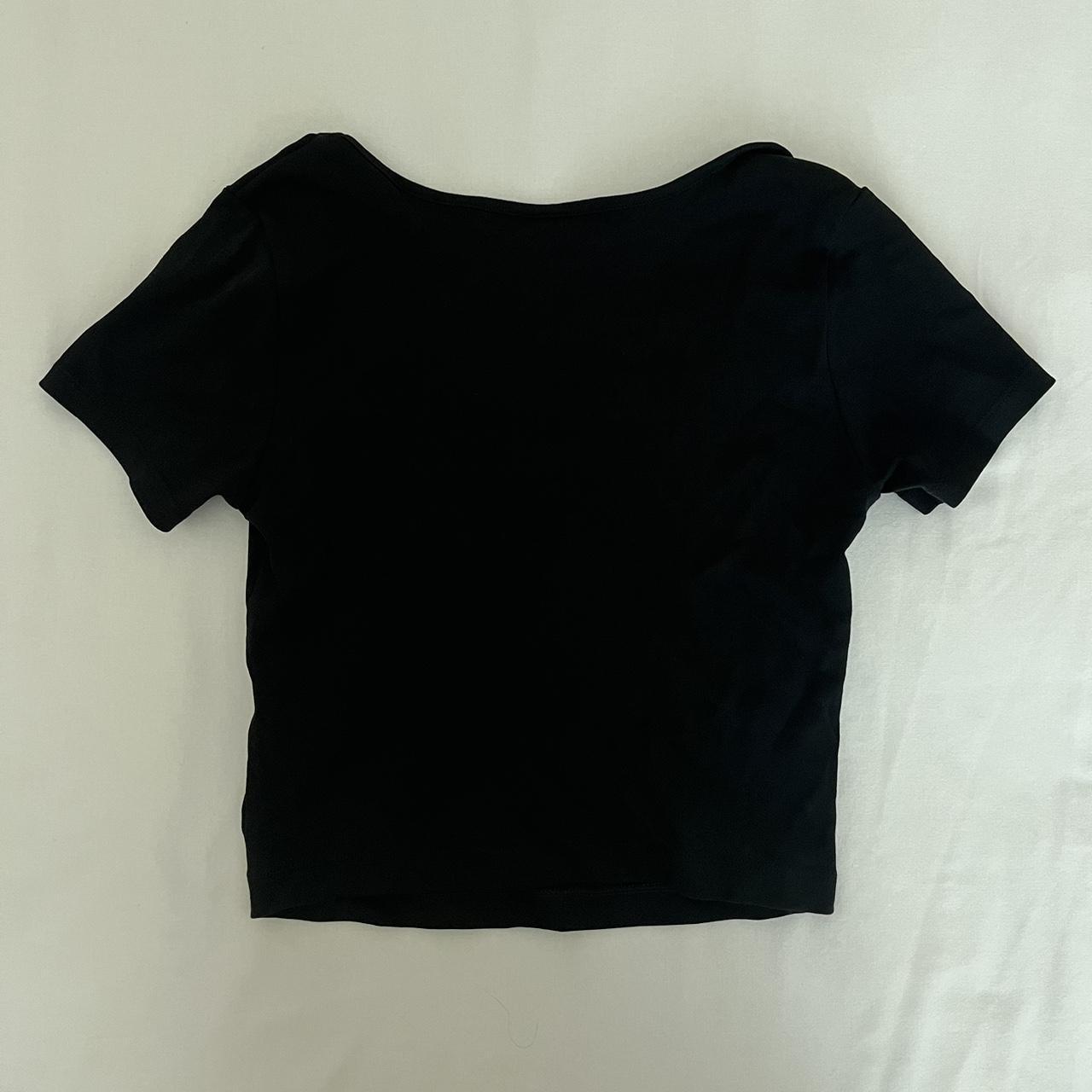 Woman's black basic tee. Has a straight cut neck... - Depop