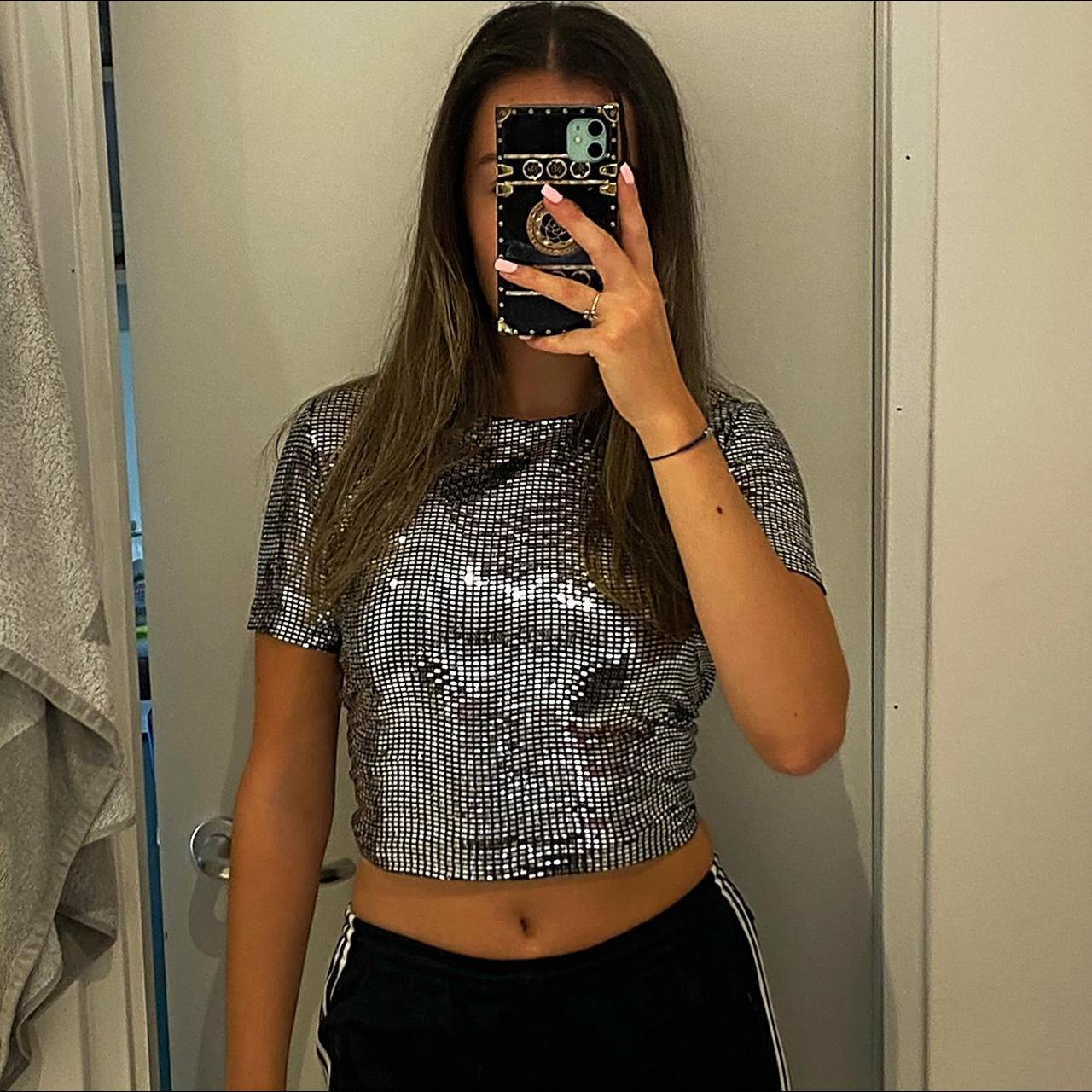 silver metallic top fits like a t-shirt but can be... - Depop
