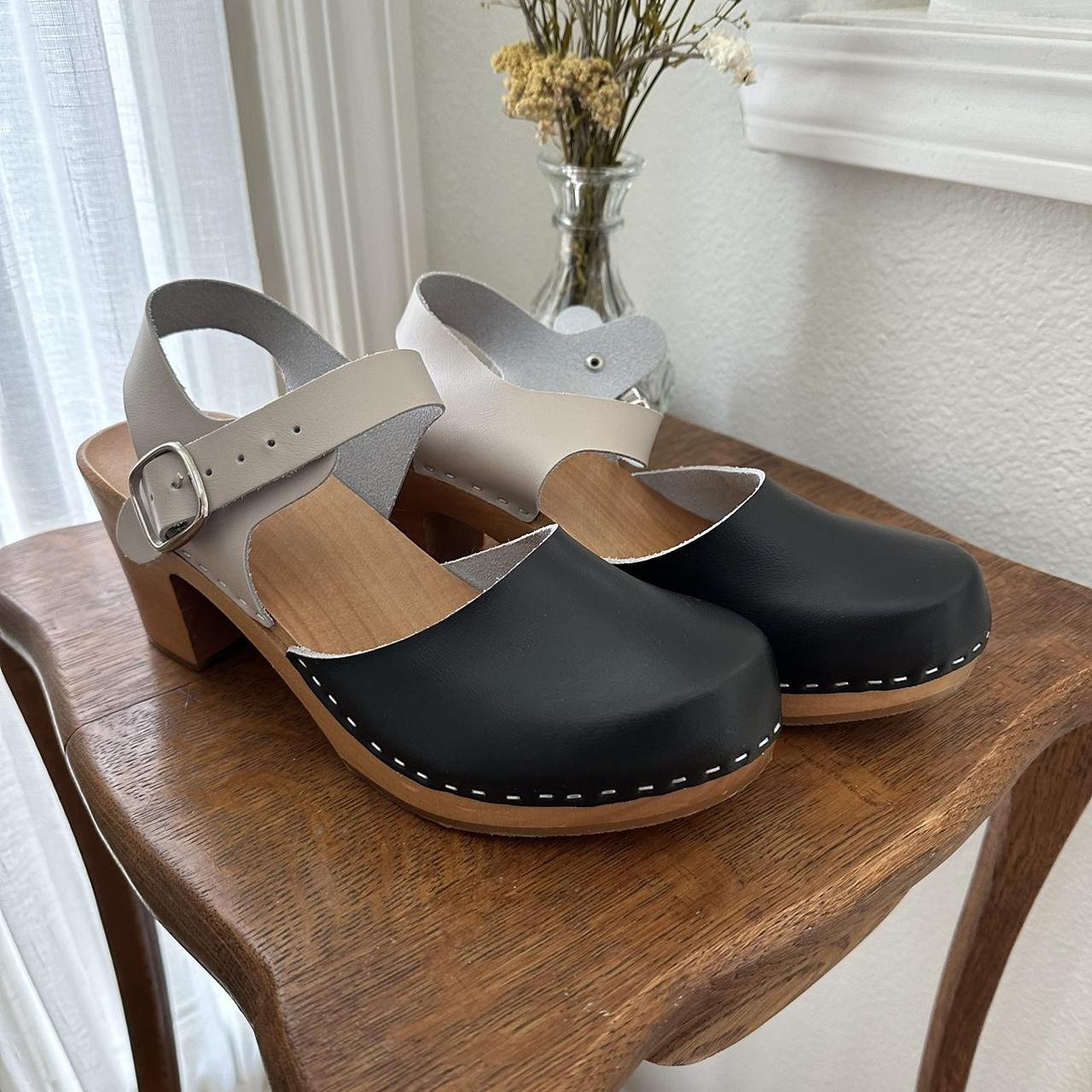 Black and gray wooden clogs. Unsure what brand they... - Depop