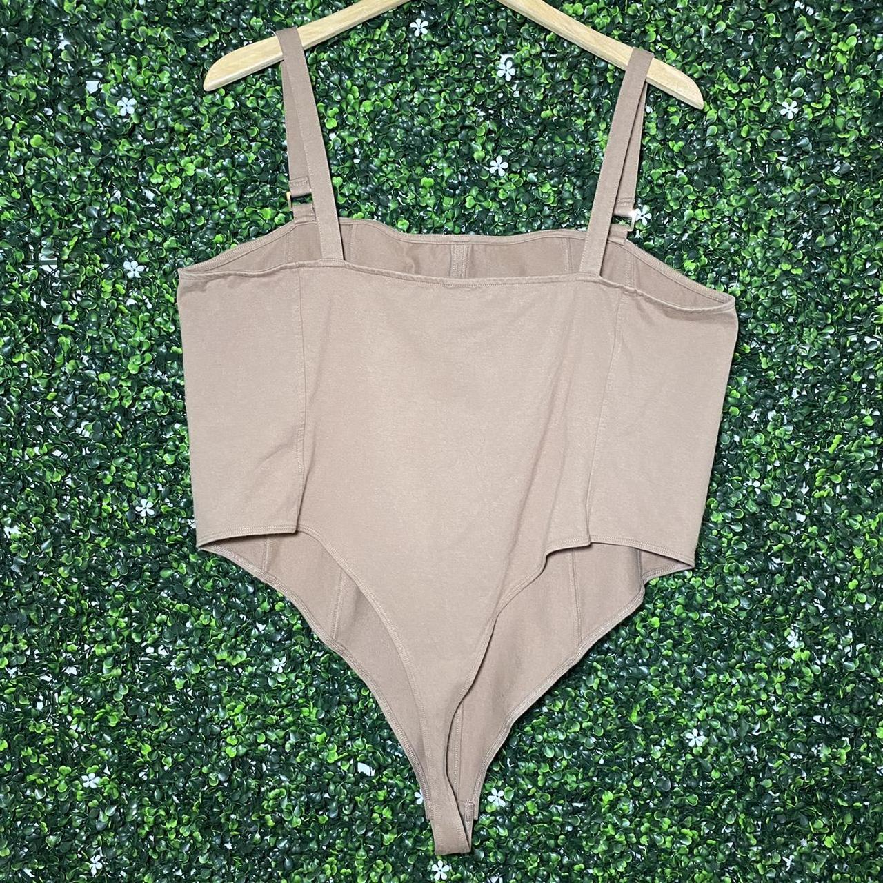 H&M tan thong bodysuit with shaping seams. Square... - Depop