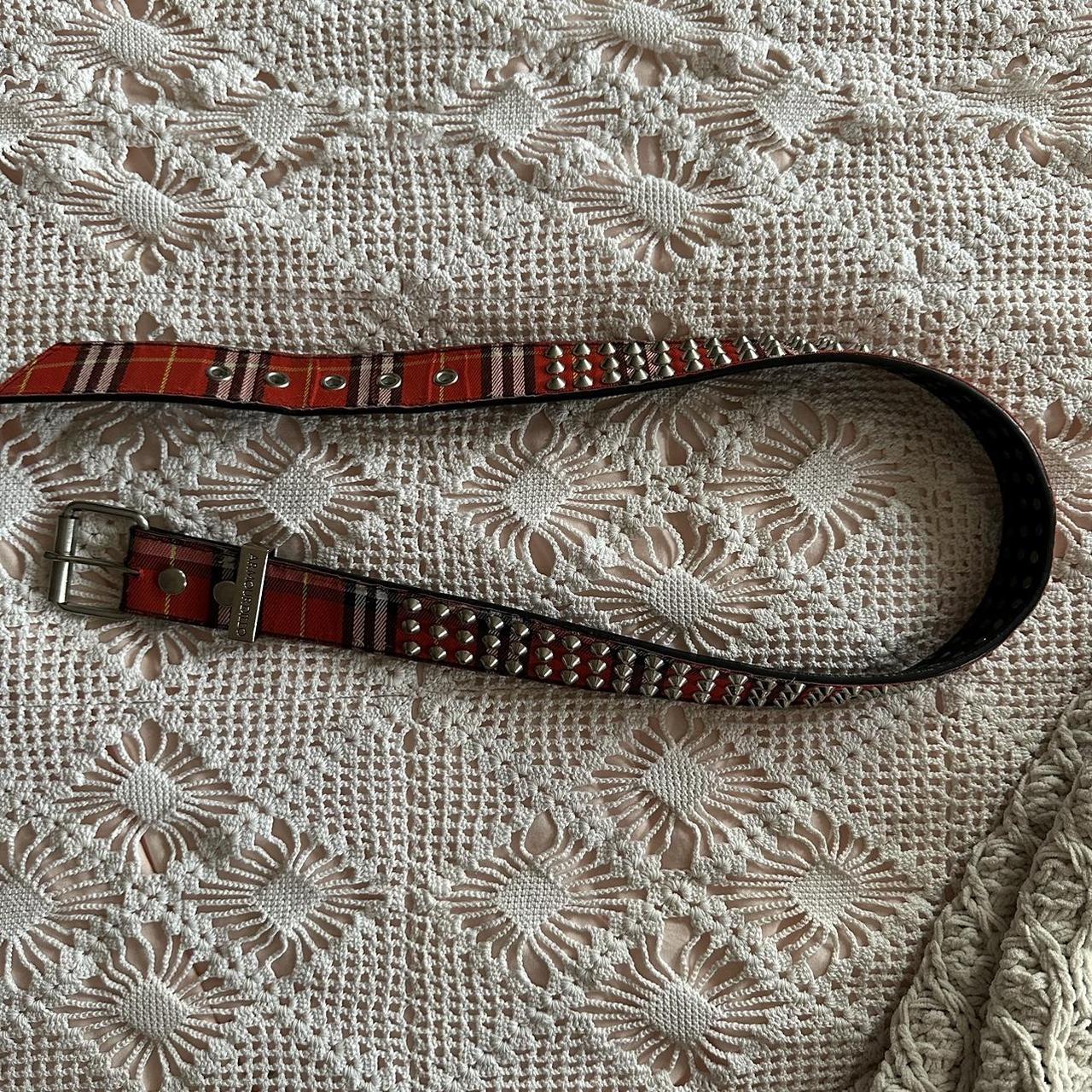 red plaid studded belt by the brand armour - all... - Depop