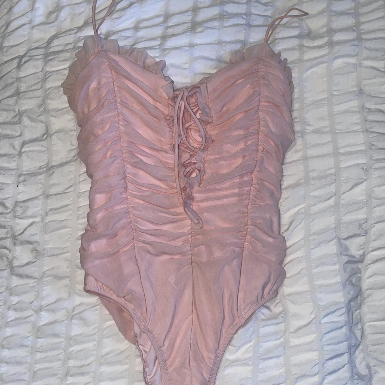 Pink lace up body suit. Super flattering and cute.... - Depop