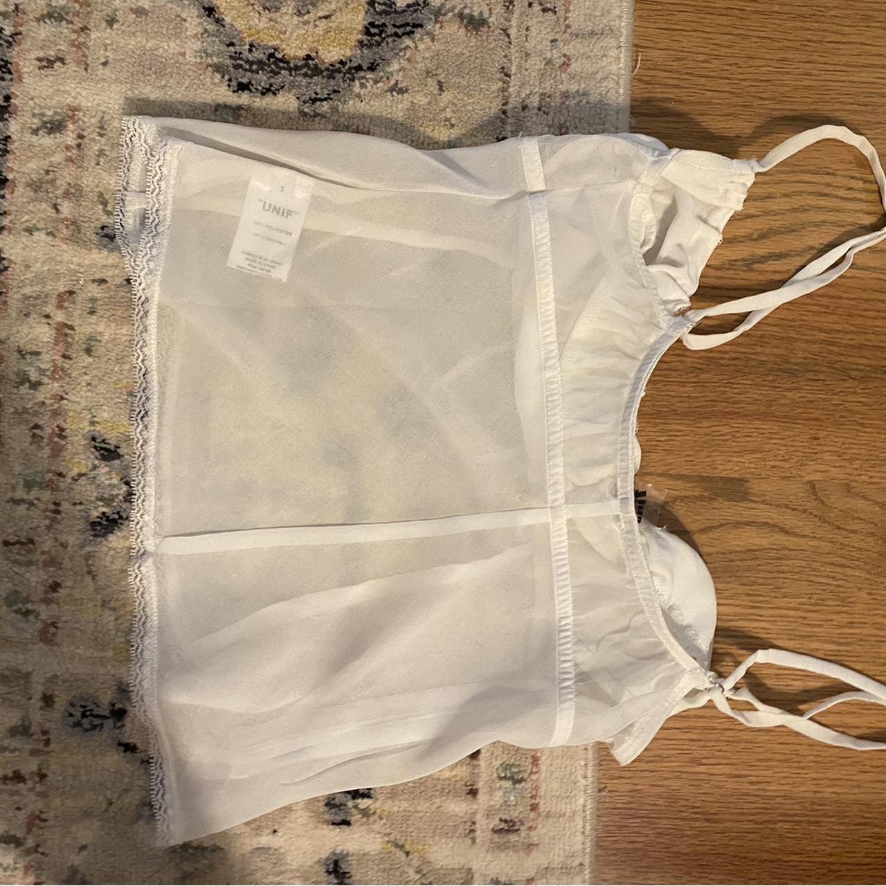 Unif angel tank Super cute but small dot on the mesh... - Depop