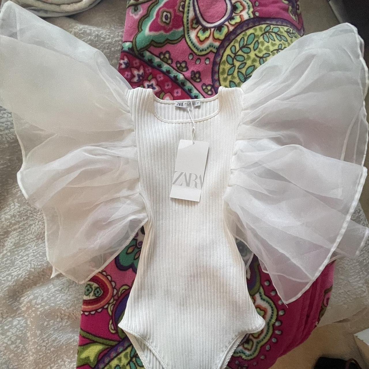 Trendy zara ribbed ruffle sleeve body suit in white... - Depop