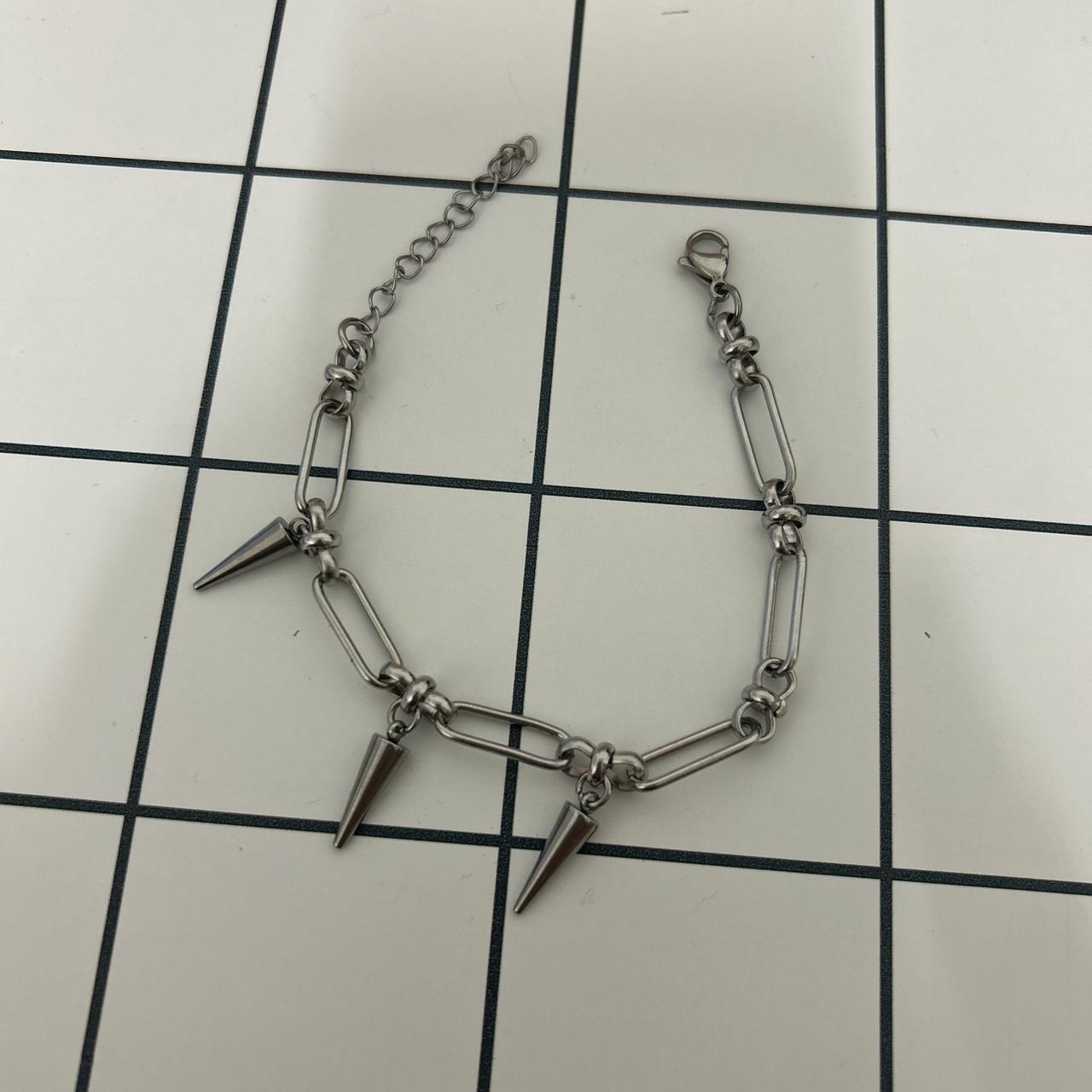 Imperfect stainless steel spike chain bracelet... - Depop