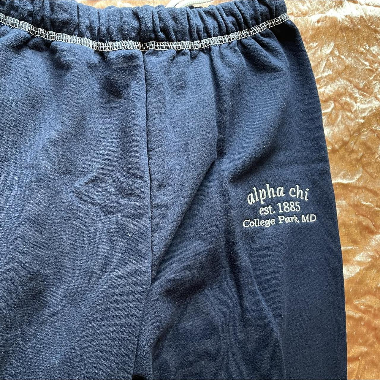 Omega Women's Navy and White Joggers-tracksuits | Depop