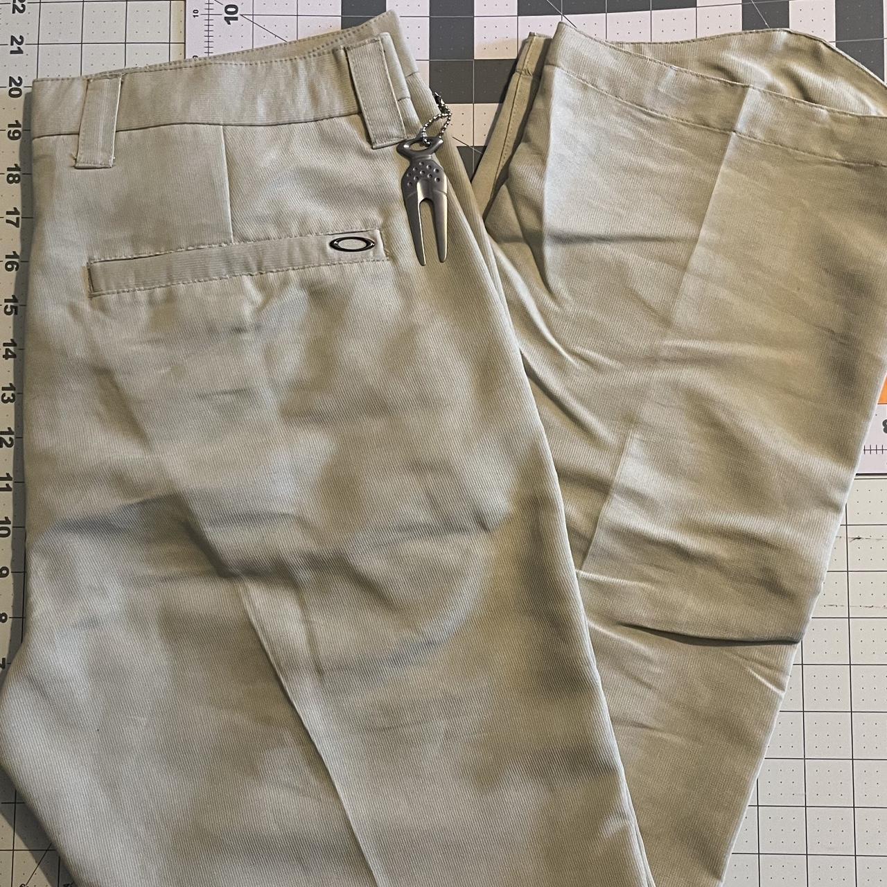 Oakley Men’s khaki golf pants, size 34x32 - Depop