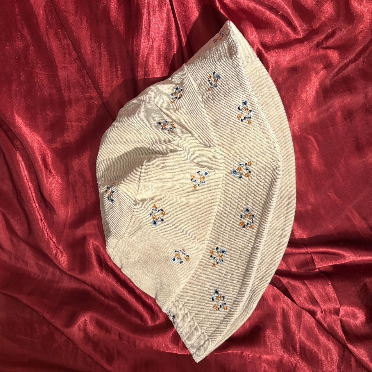Cream and multi-coloured bucket hat with floral... | Depop