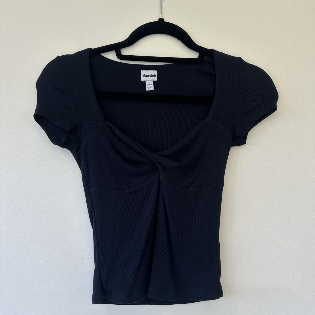 Sun-Deh Black stretchy top with a twist front detail... | Depop